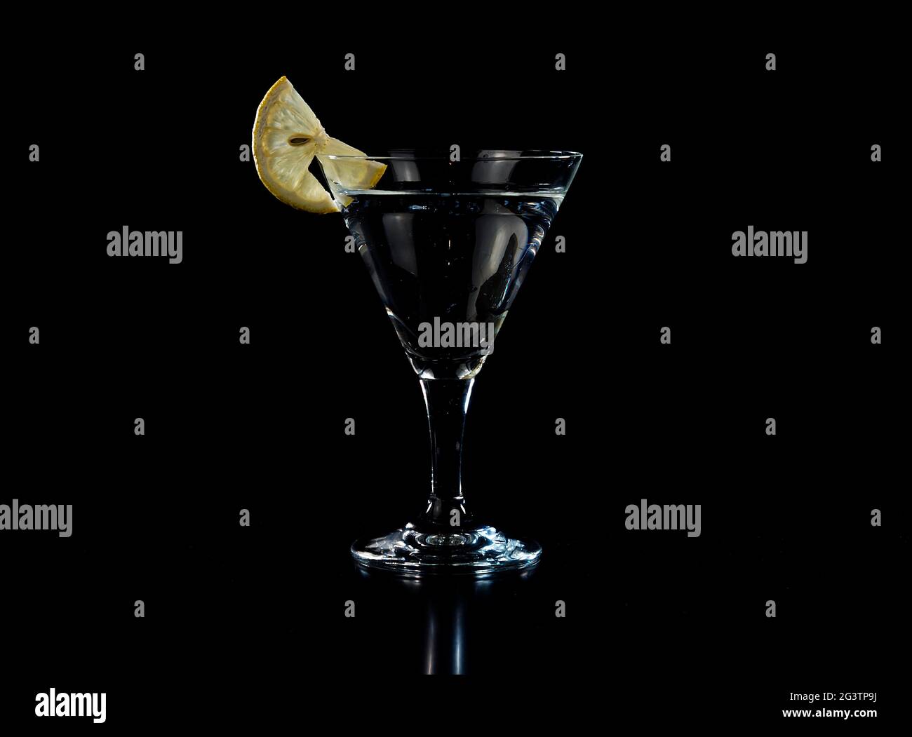 A martini glass cocktail with citrus fruit Stock Photo - Alamy