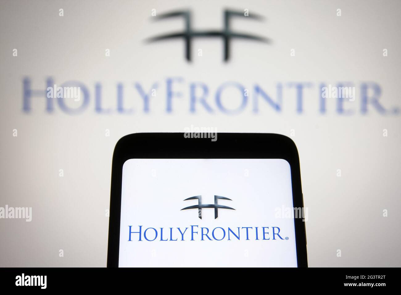In this photo illustration, HollyFrontier Corporation logo is seen on a ...