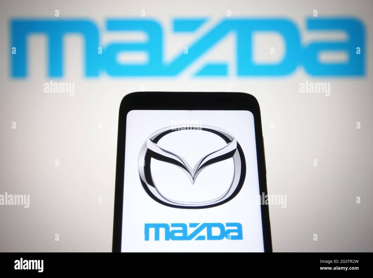 In this photo illustration, Mazda Motor Corporation logo is seen on a ...