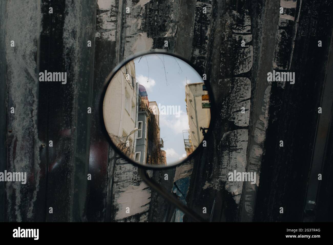 Reflection of buildings in a road mirror Stock Photo - Alamy
