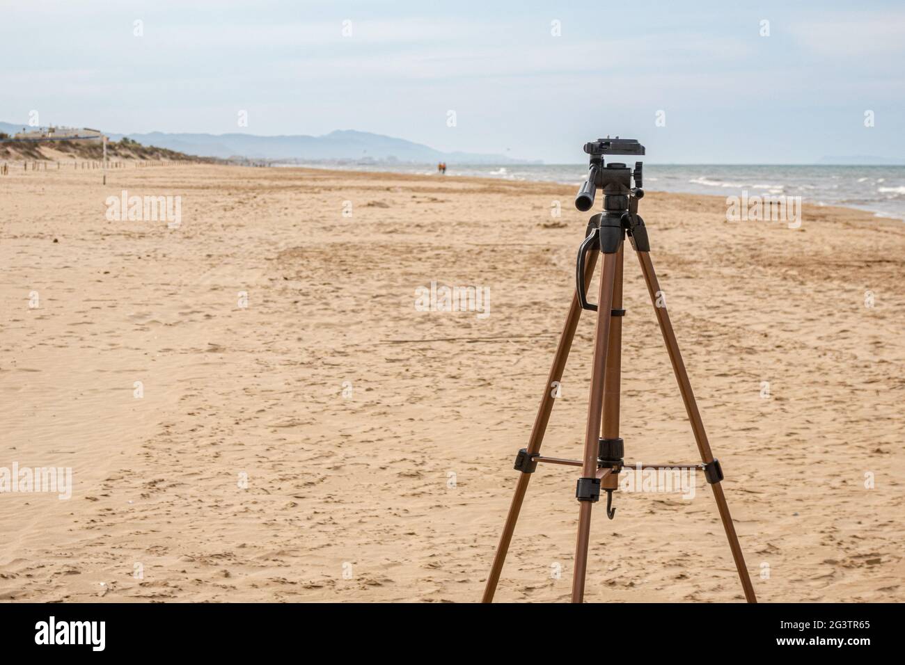 Tripod placed at the beach Stock Photo - Alamy