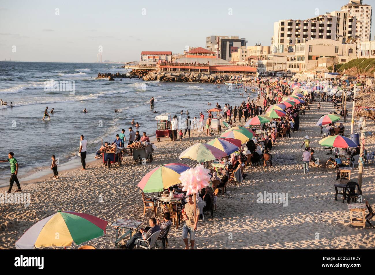 Gaza, Palestine. 17th June, 2021. Palestinians enjoy the warm weather ...