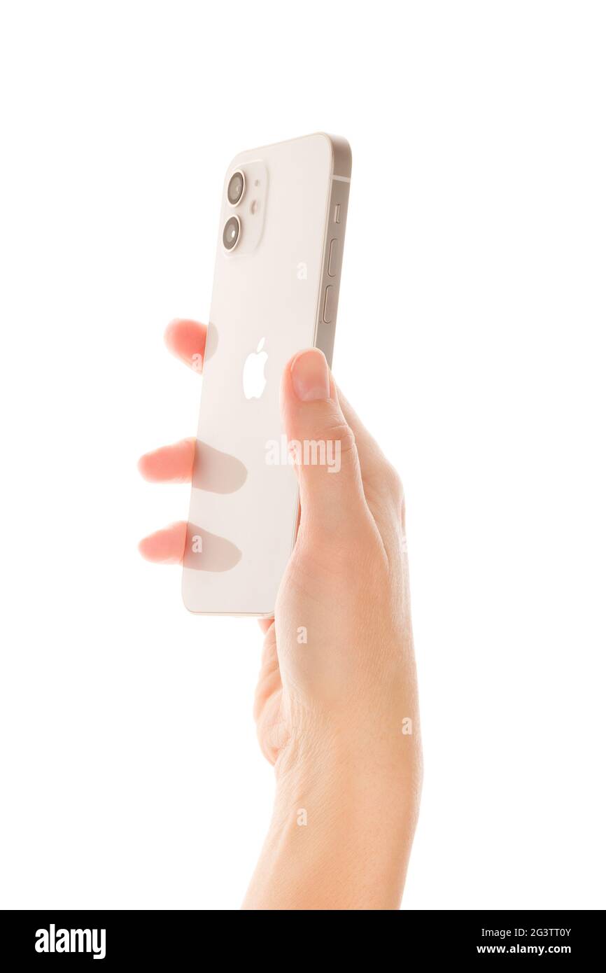 IPhone 12 White in female hand Stock Photo - Alamy