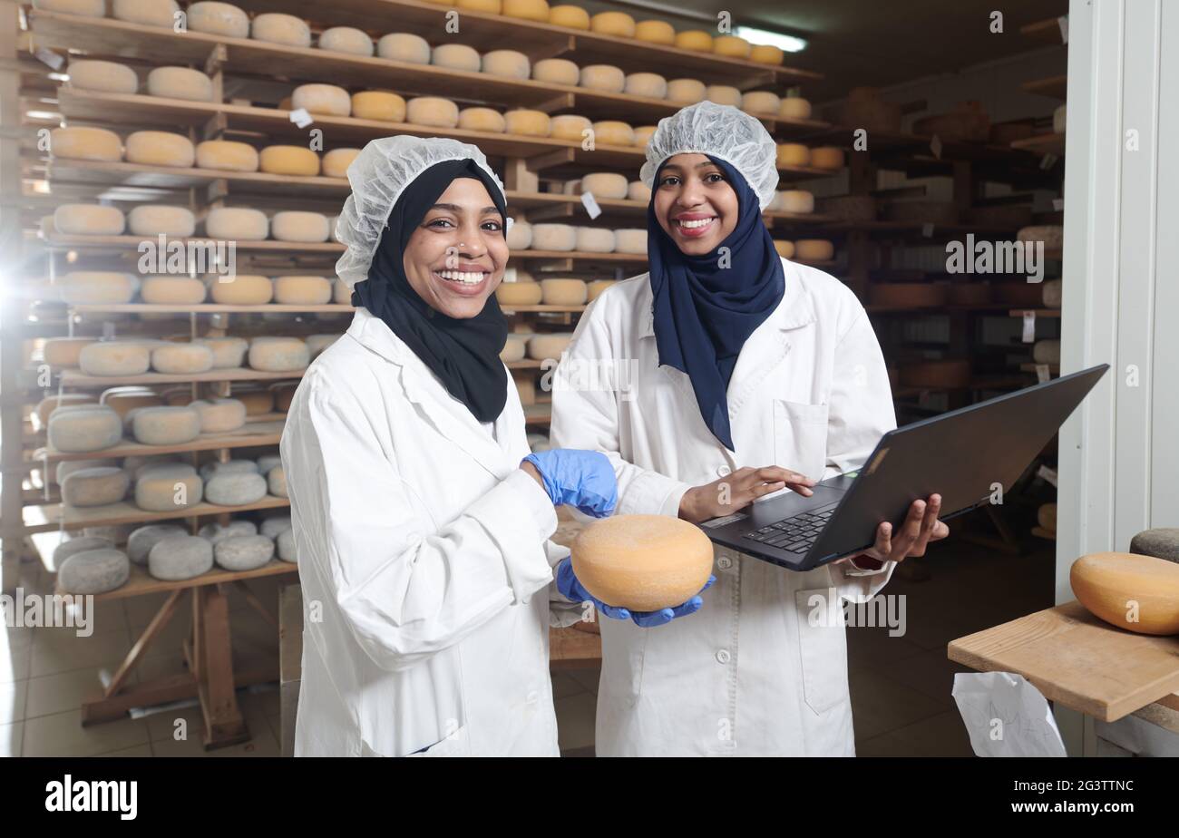 Business woman team in local cheese production company Stock Photo - Alamy