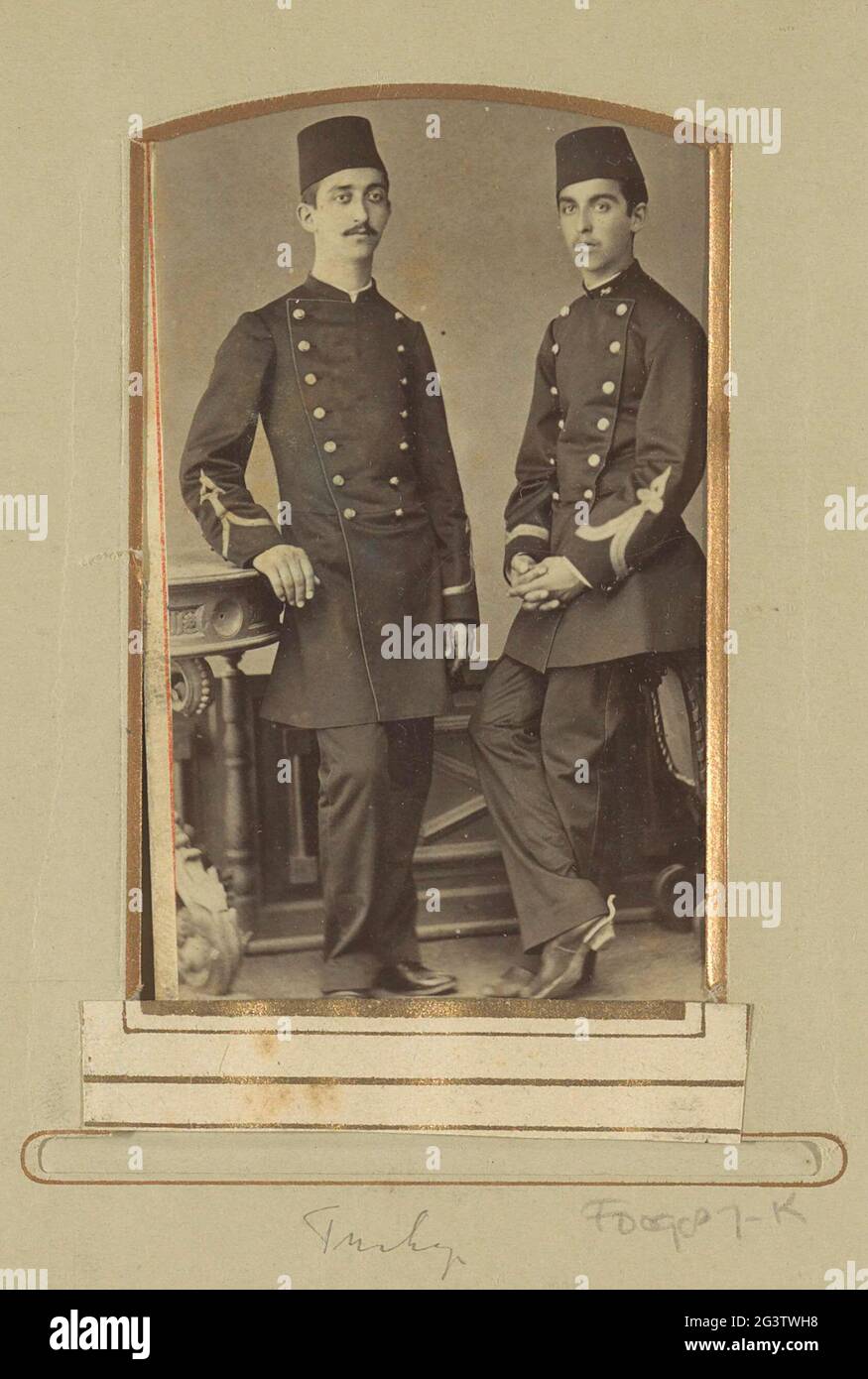 Portrait of two (presumably) Turkish soldiers, standing at a table with ...