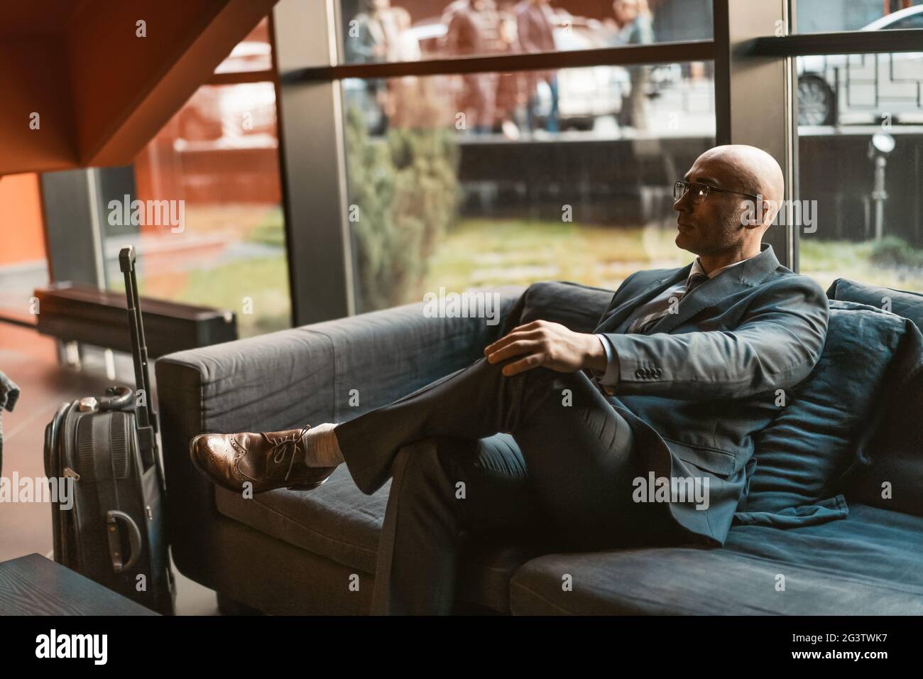 Business man waiting in office lobby hi-res stock photography and ...