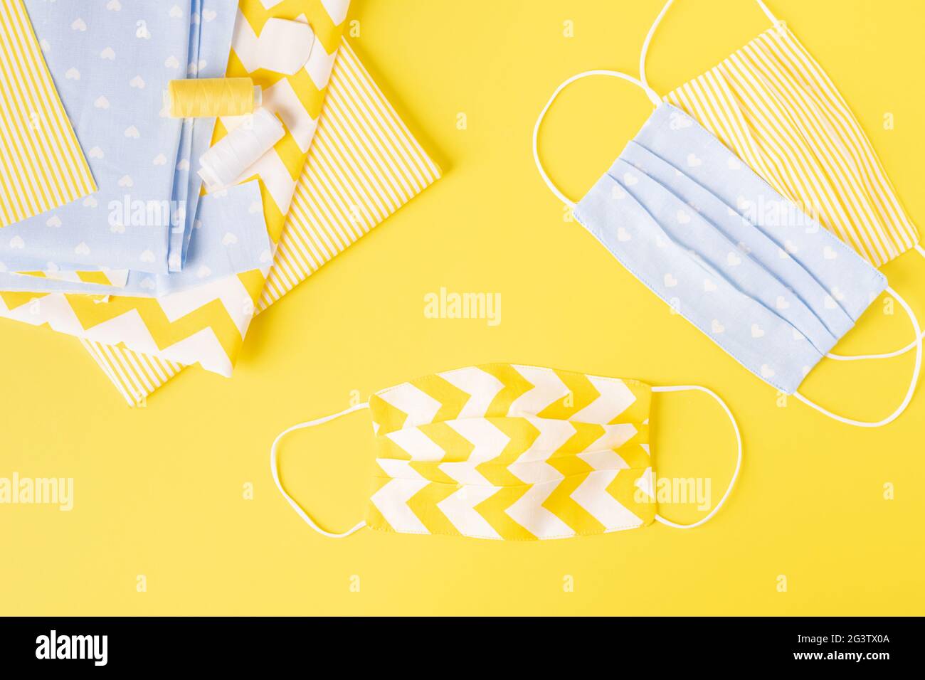 Eco-friendly reusable cloth face shield and sewing accessories on top ...