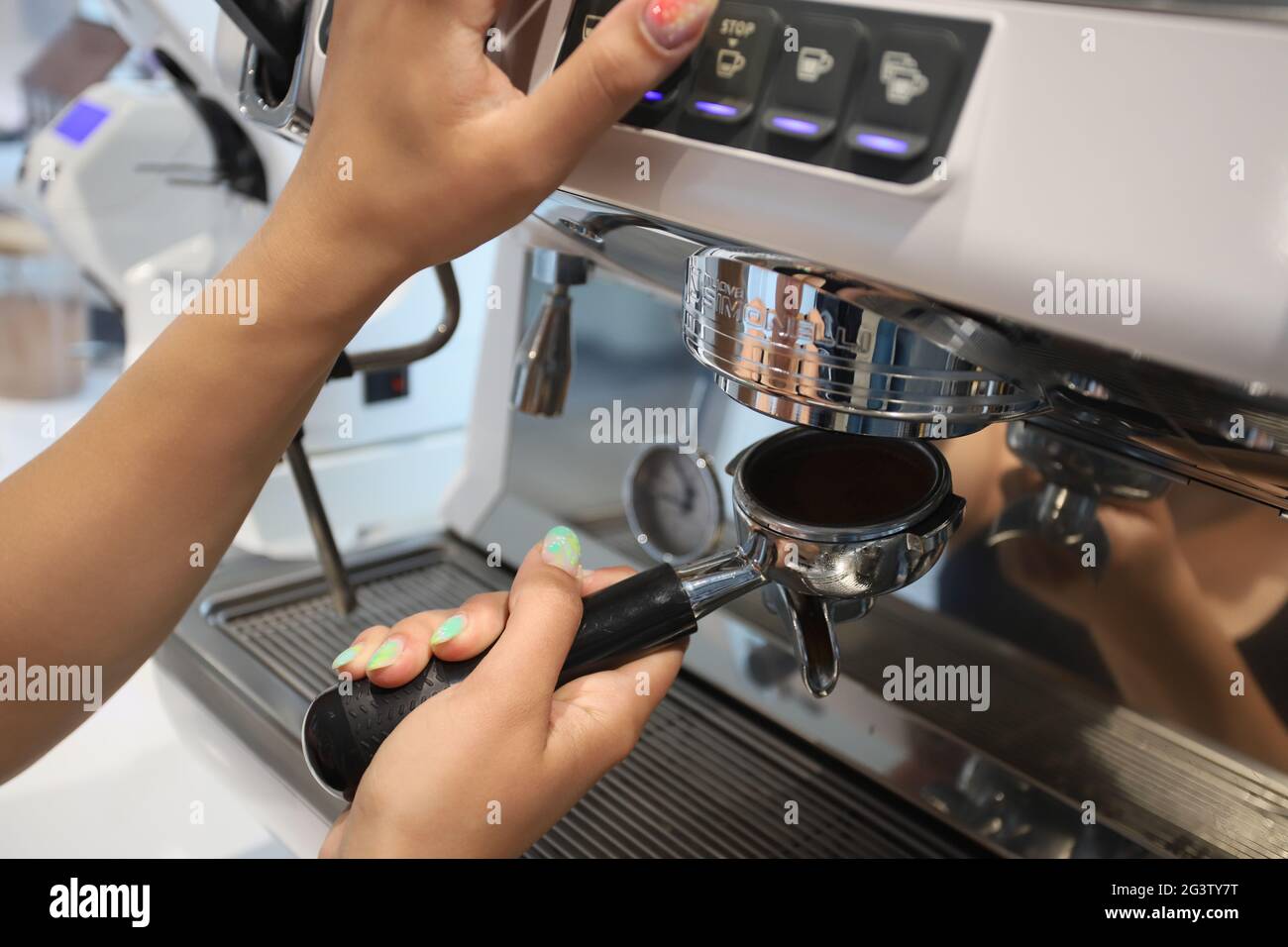Minsk. Belarus - 06.06.2021: A cute barista makes coffee in a coffee ...