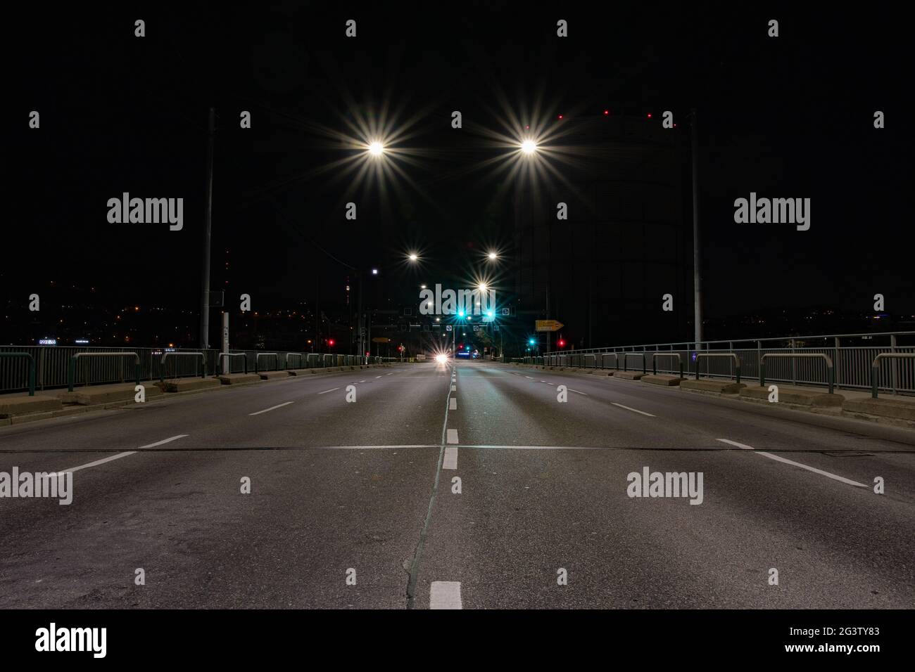 Empty highway surrounded by fields captured in the dark night Stock ...