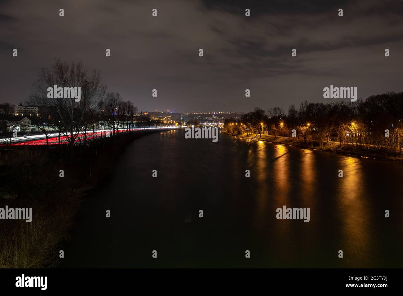 Reflection of lights on a canal in a city captured at night Stock Photo ...