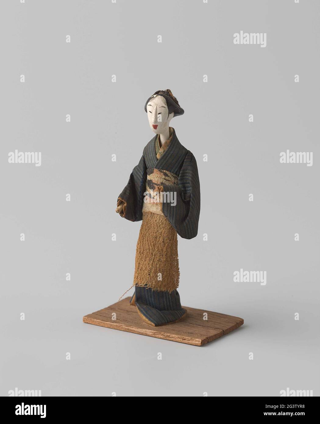 Pop of wood in Japanese clothing. Puppet made of wood in Japanese ...