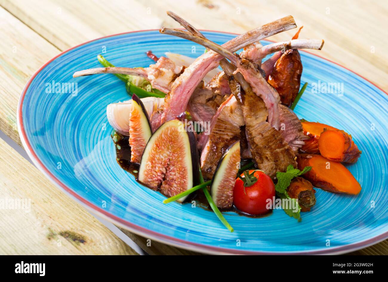 BBQ mutton ribs served with fresh figs Stock Photo - Alamy
