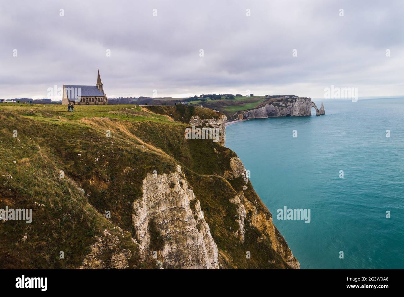 Famous Etretat Aval cliff and natural arch landmark by the ocean in ...
