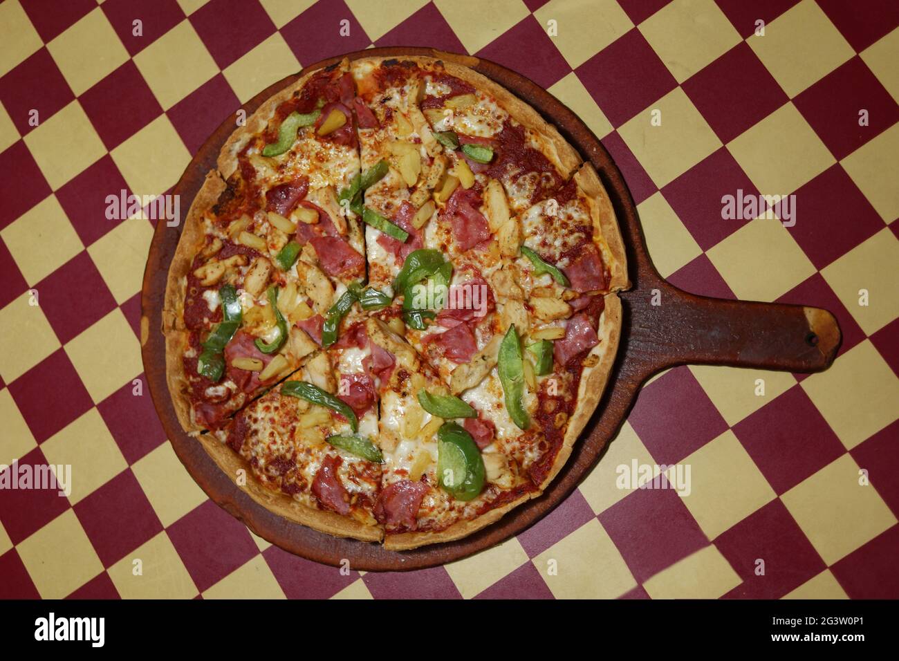 Delicious fresh pepperoni and pepper pizza Stock Photo - Alamy