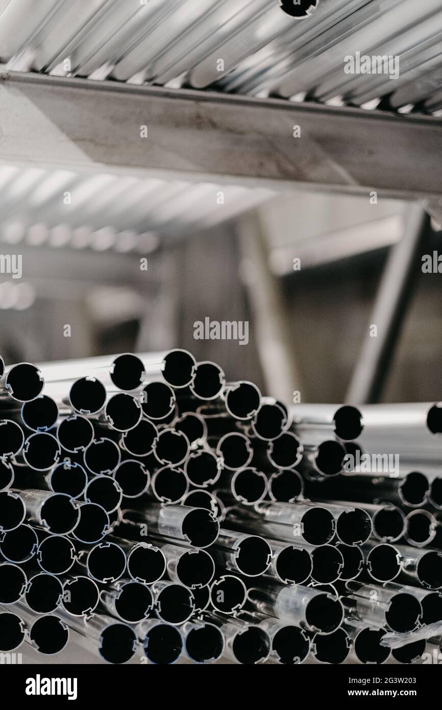 Metal rods in roller blind factory Stock Photo - Alamy