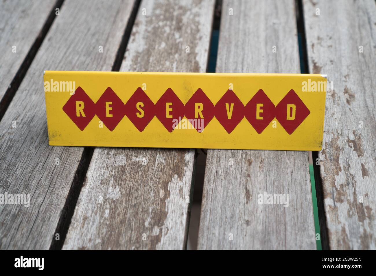 Restaurant reserved table sign on wooden table Stock Photo - Alamy