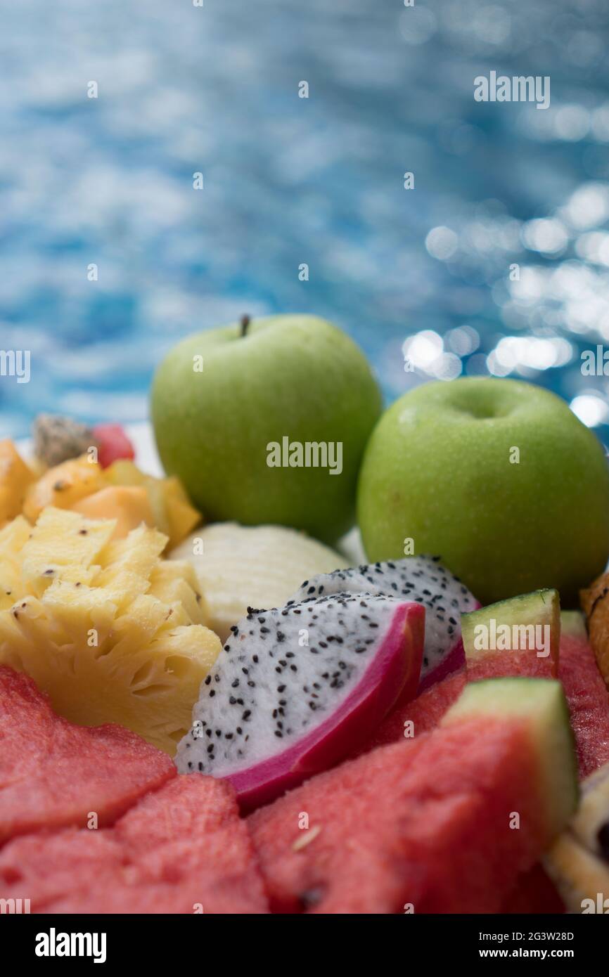 Fruit plate by hotel pool Stock Photo - Alamy