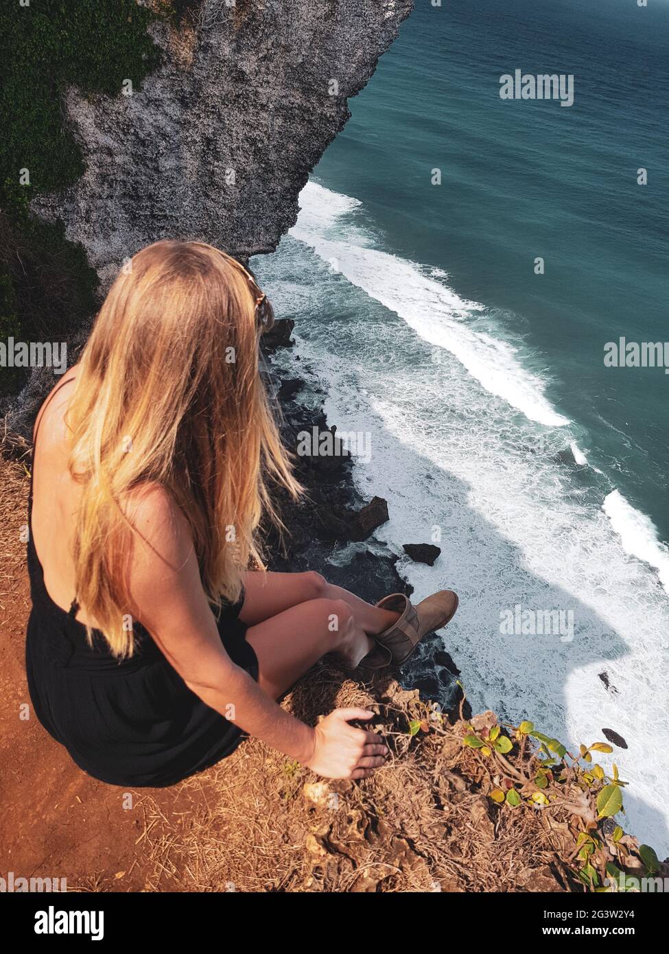 Pretty girl and crashing waves hi-res stock photography and images - Alamy