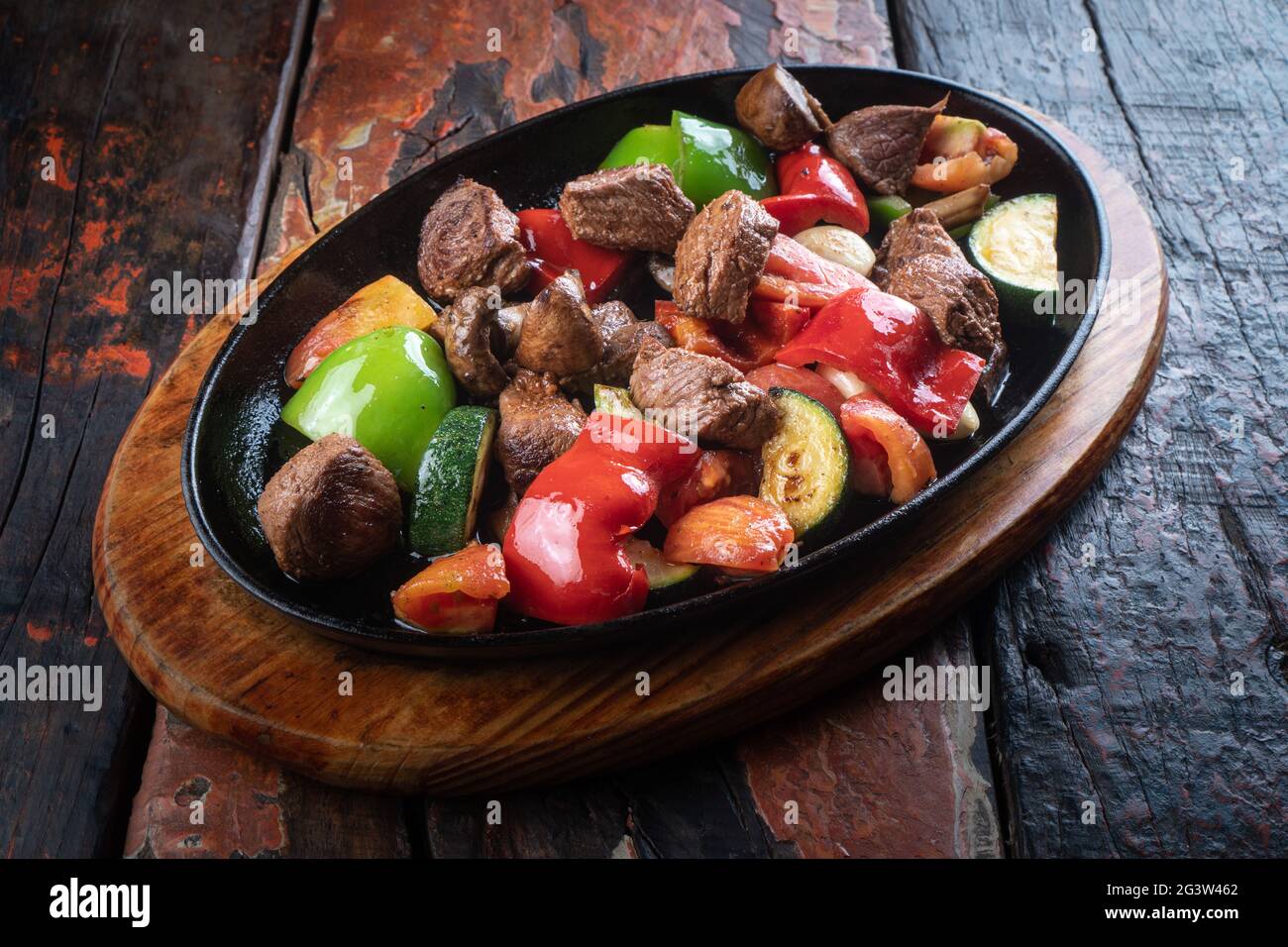 Turkish meat Et Sote on rustic woogen table Stock Photo - Alamy