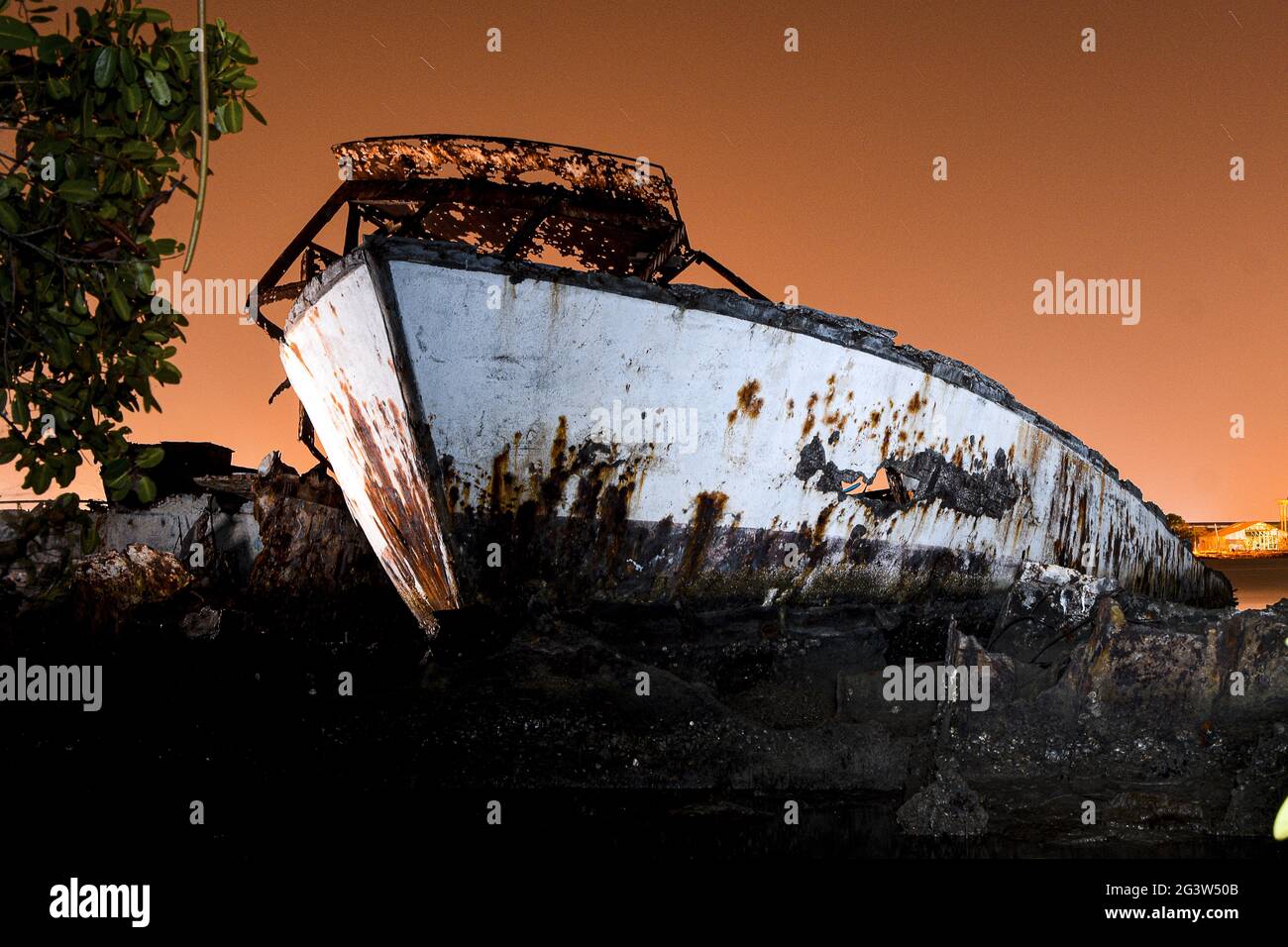 Old, rusty abandoned ship stranded at a shore against a night sky Stock ...
