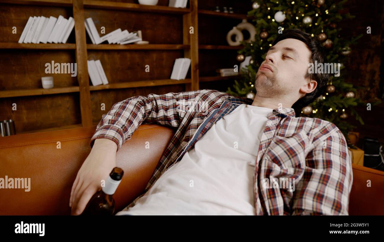 Alcohol addiction at young age. Caucasian male cannot stop drinking ...