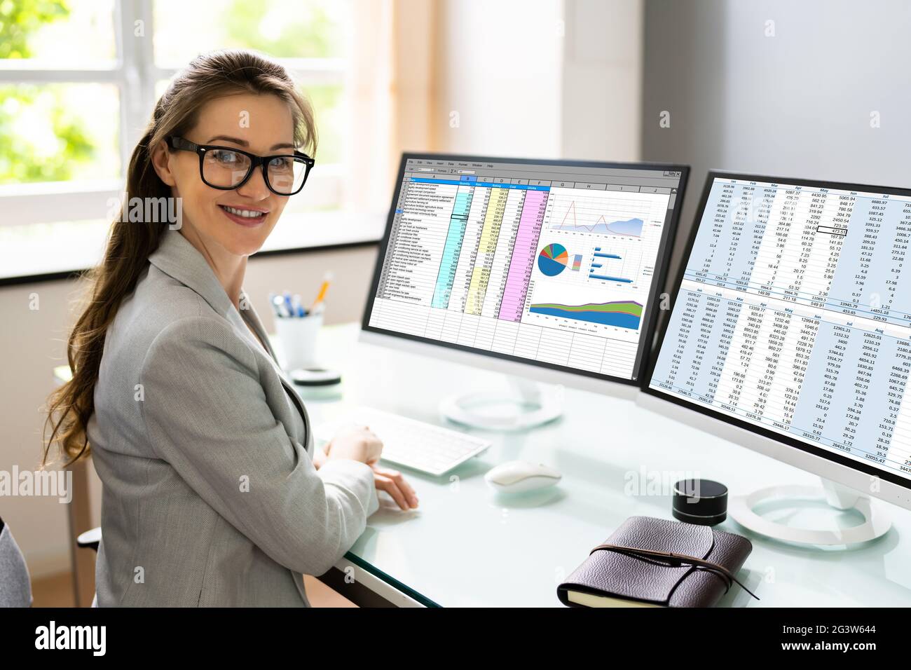 Spreadsheet Analyst Employee Using Computer Monitors For Analysis Stock ... Spreadsheet Analyst Employee Using Computer Monitors For Analysis Stock ...
