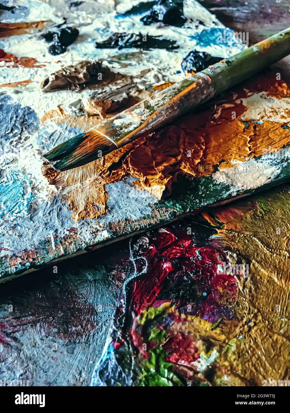 Art tools in artist studio, paint brushes and oil palette, creative ...