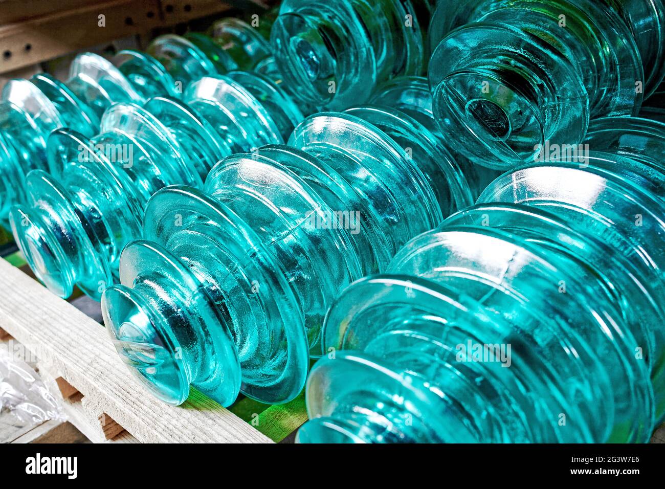 Glass insulators for high-voltage electric poles are on the shelf Stock ...