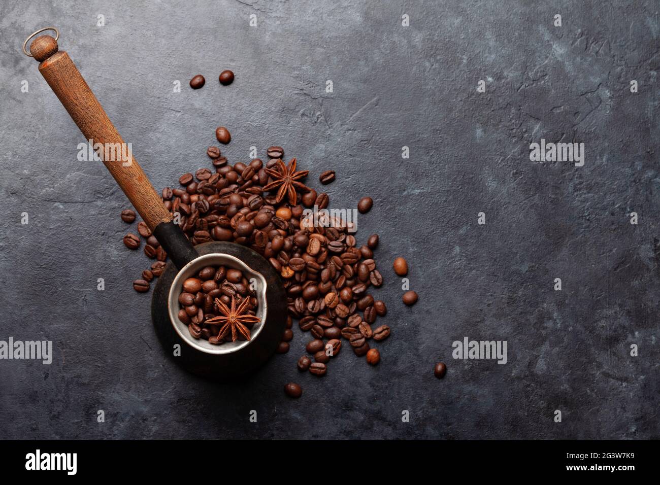 Roasted coffee beans and Turkish jezve. Top view flat lay with copy ...