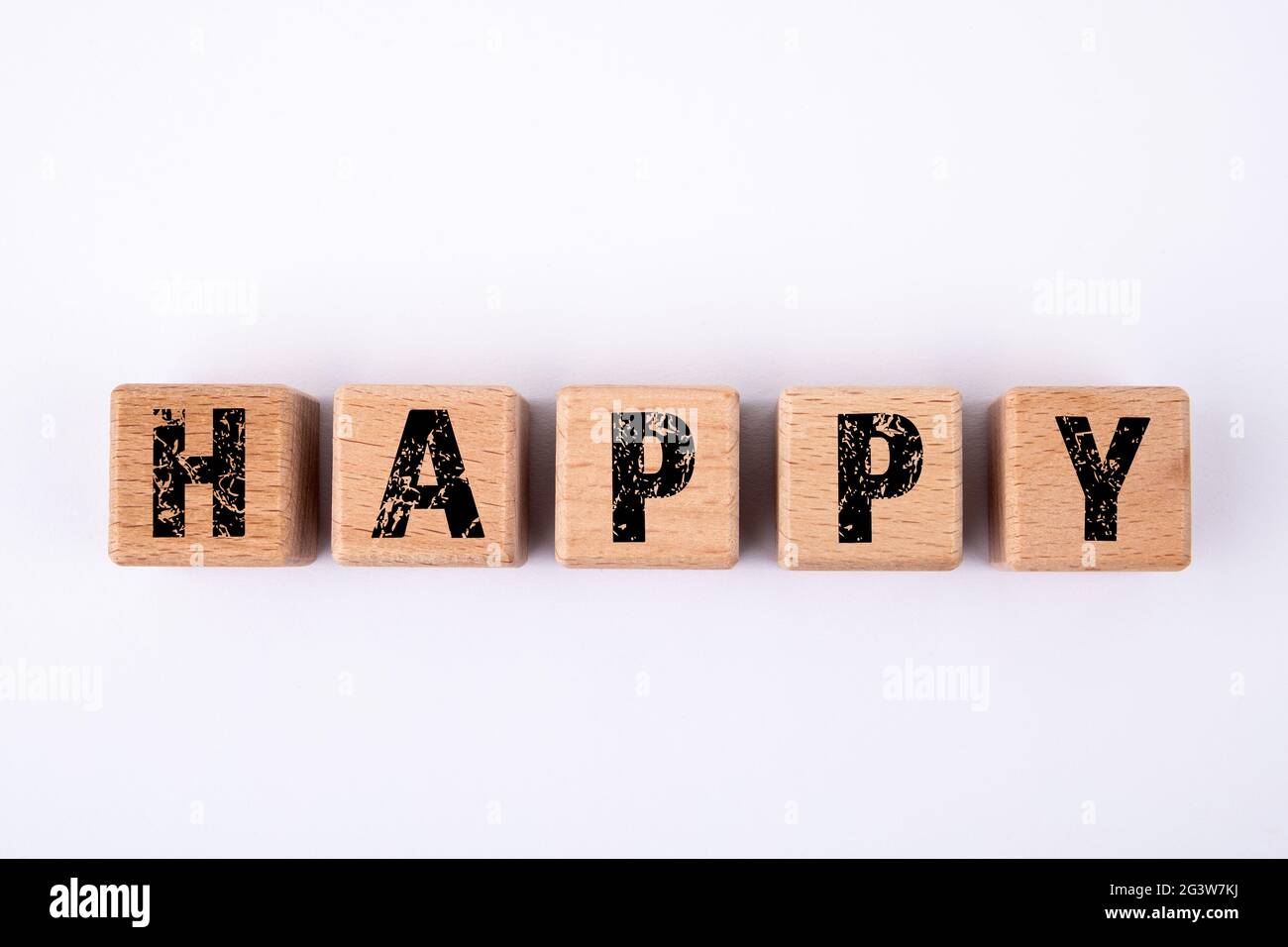 HAPPY. Five wooden cubes on a white background Stock Photo - Alamy