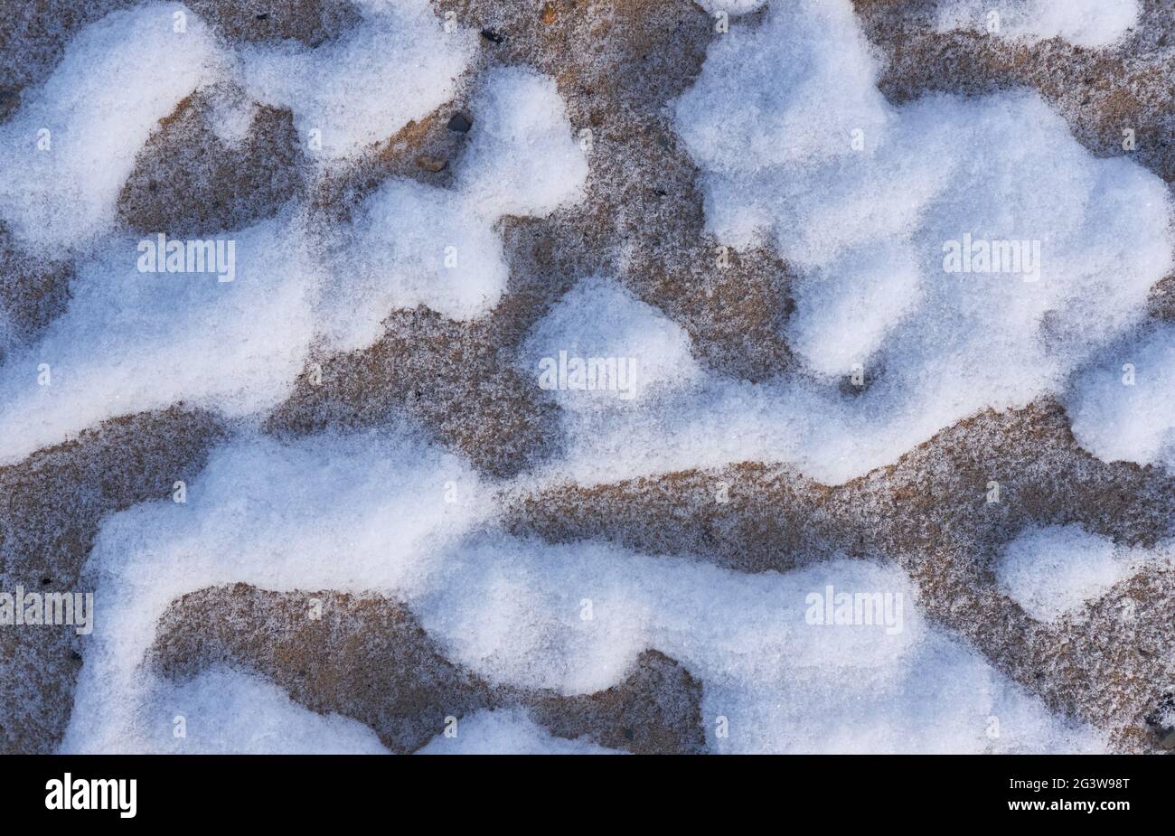 Snow patterns in the sand Stock Photo - Alamy