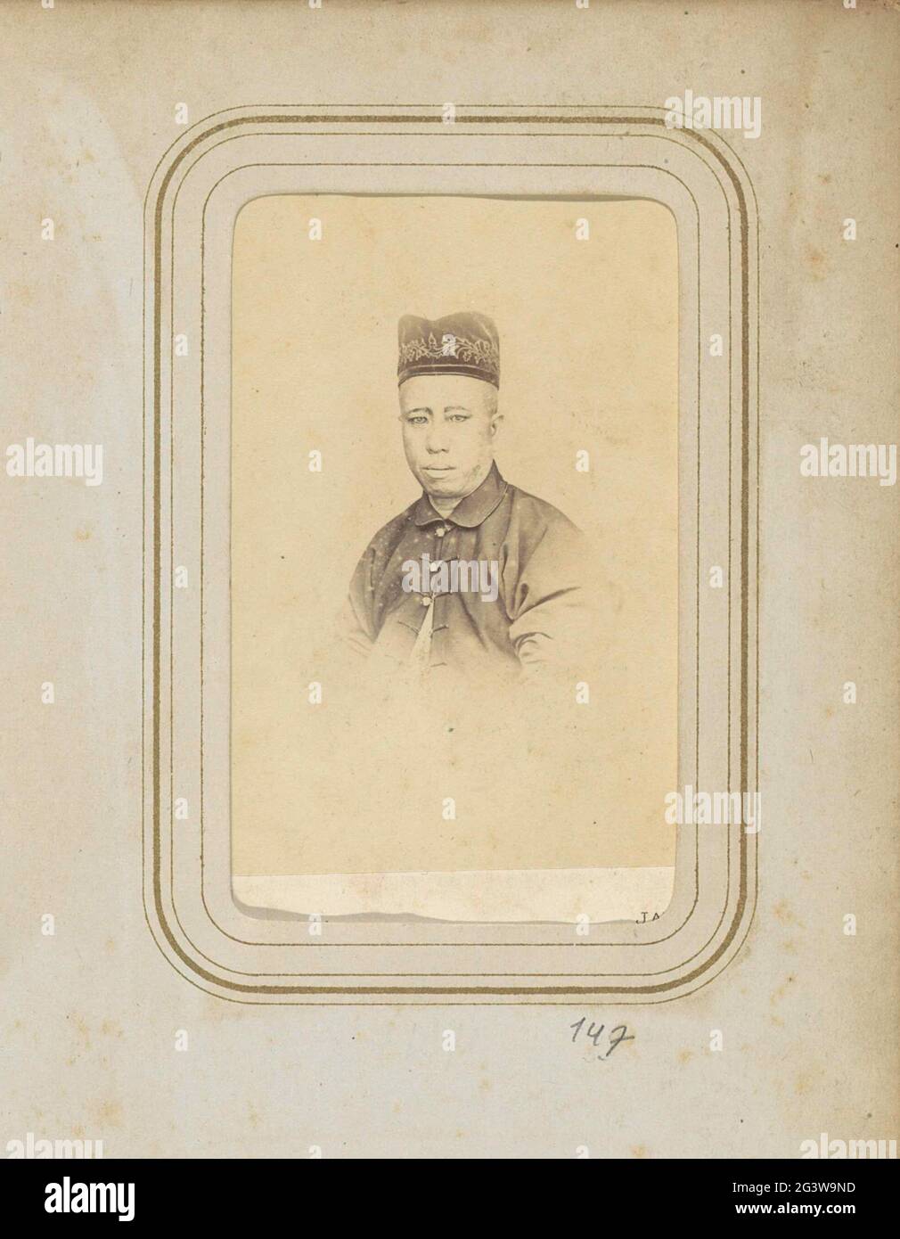 Portrait of a Chinese Indian man in a jacket with a headdress. Part of ...