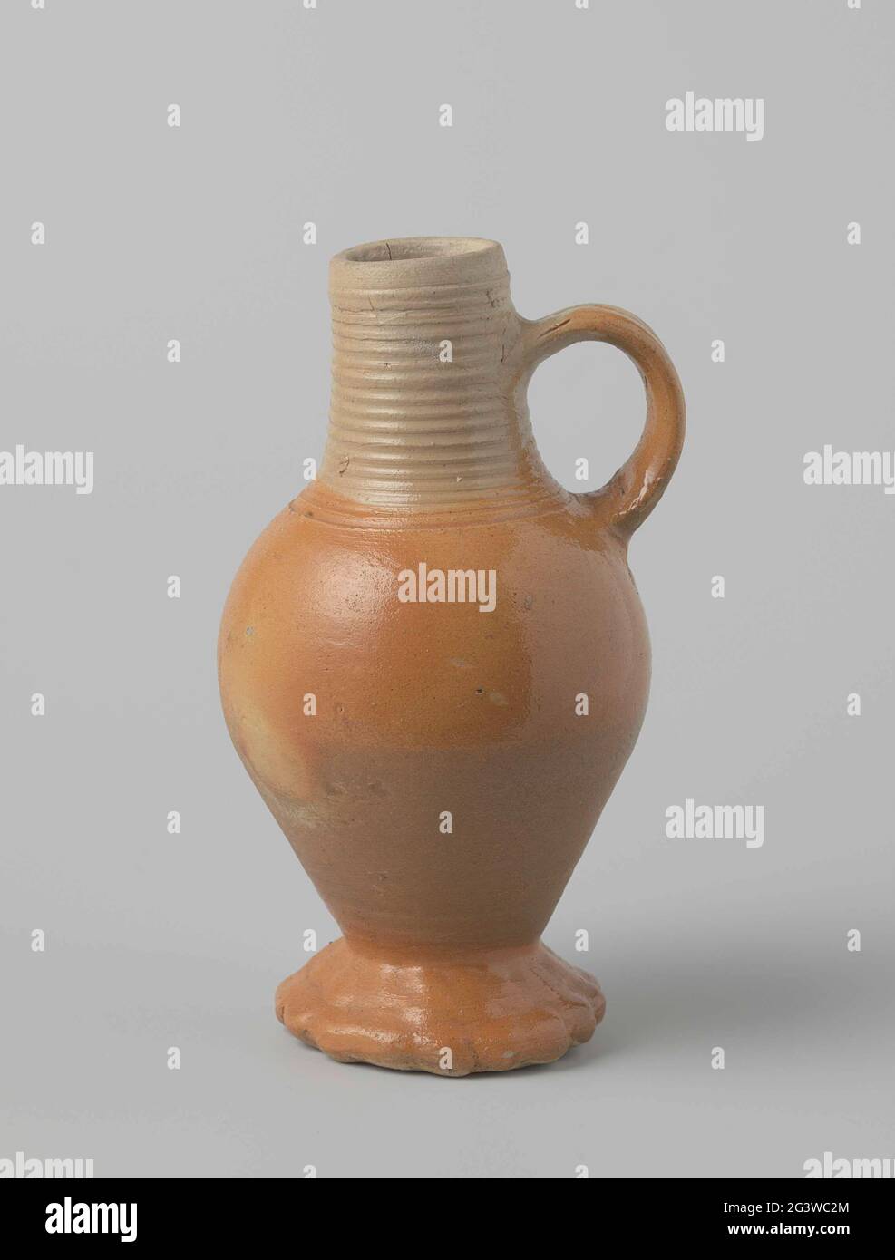 Jug. Jar with ear, from stoneware. The foot is slightly serrated, the ...