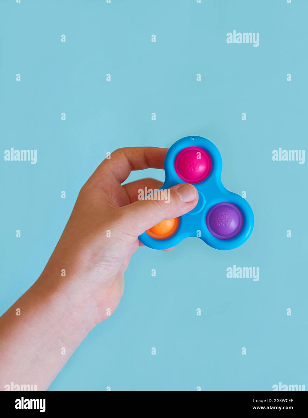 Children's Hand Holding Silicone Toy Spinner Simple Dimple Stock Photo ...