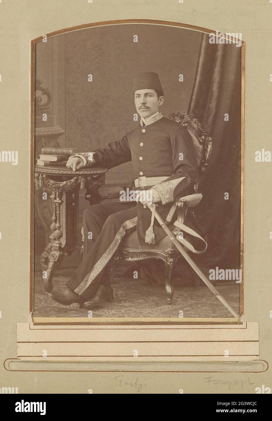 Portrait of a (presumably) Turkish soldier, sitting. Part of album with ...