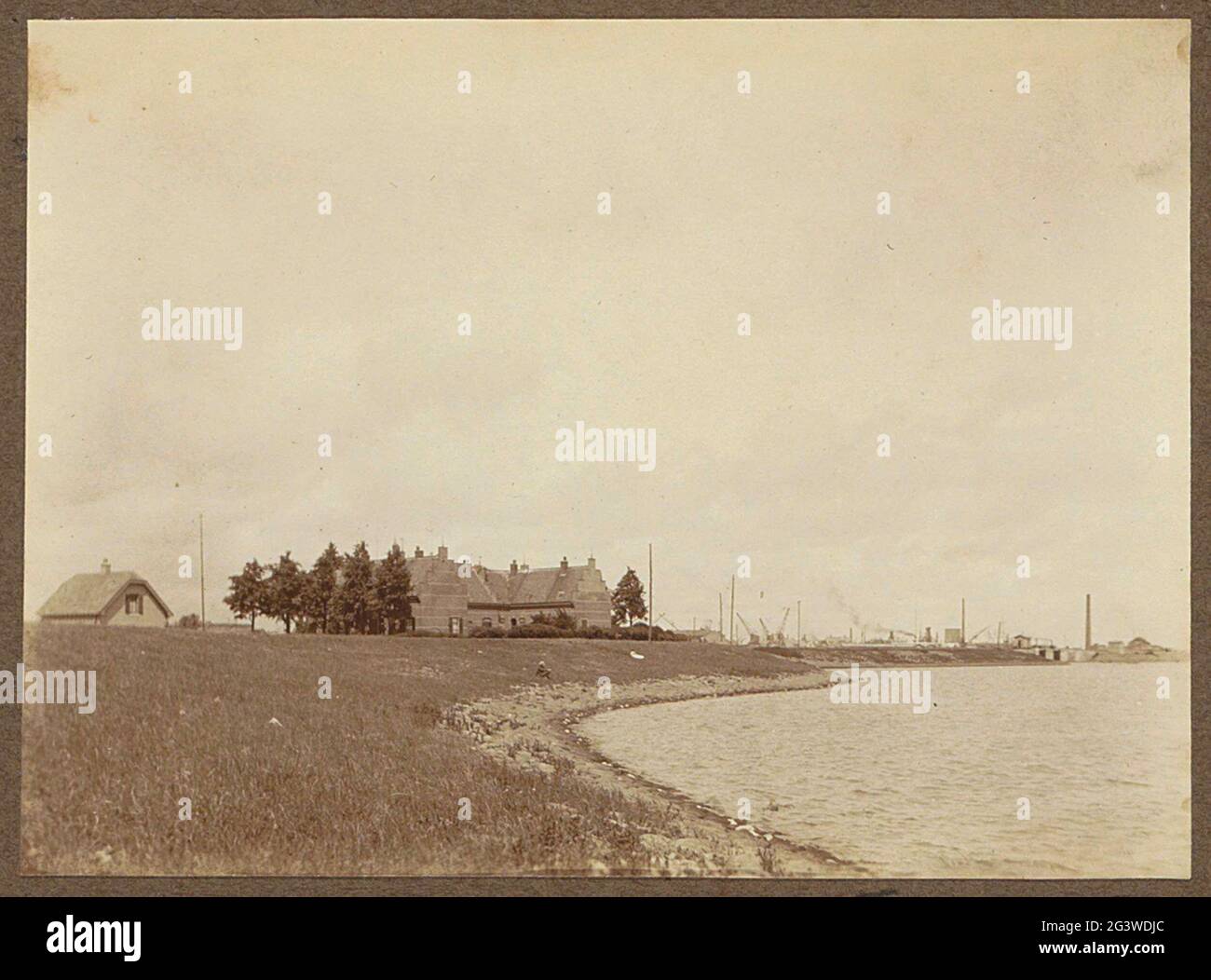 Houses on a dike at Zeeburg, on the horizon excavators. Part of album ...