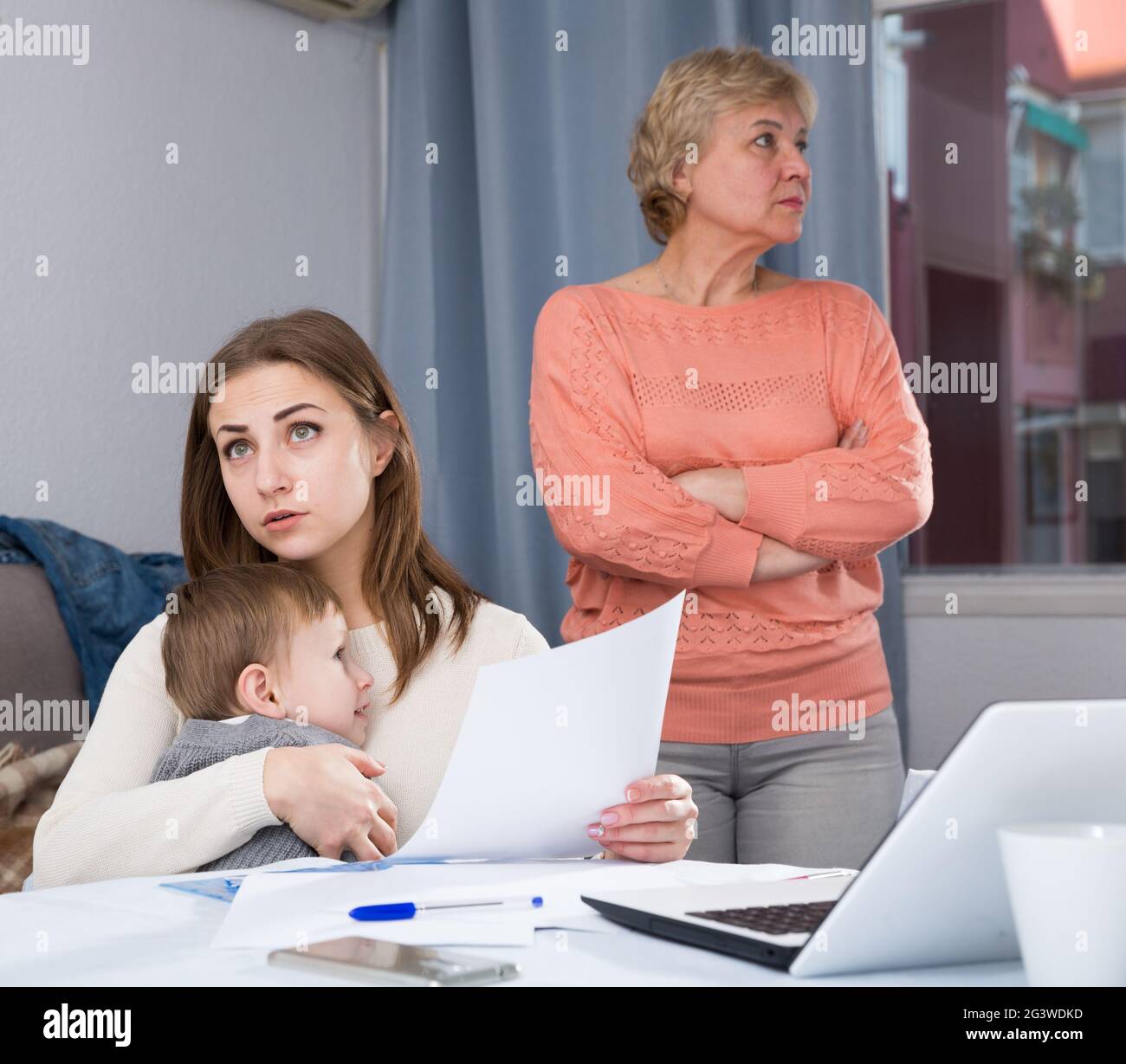 Outraged female are having disagreements with her mother for problems ...