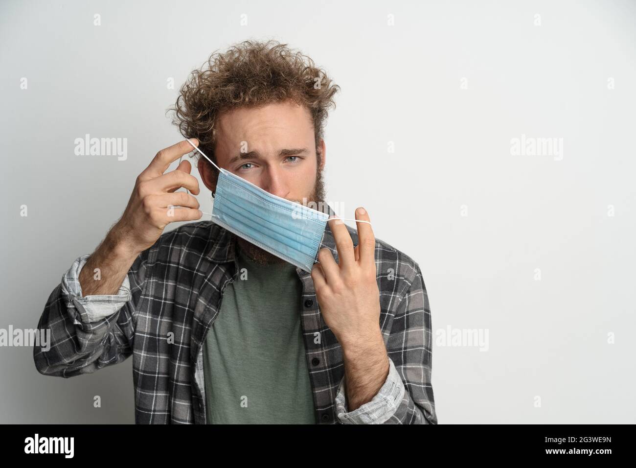 Man holding mask face hi-res stock photography and images - Alamy