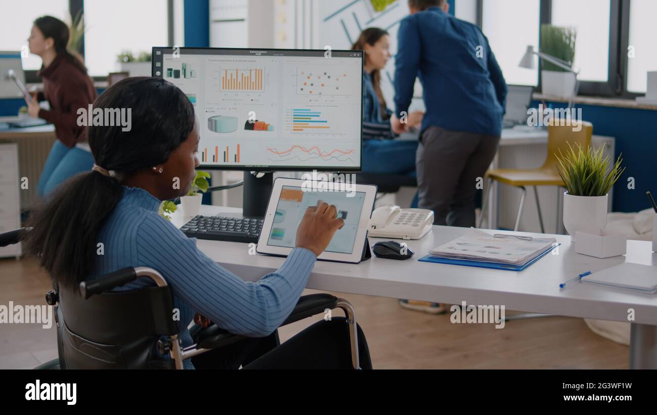 Black handicapped woman entrepreneur with locomotor disabilities using ...