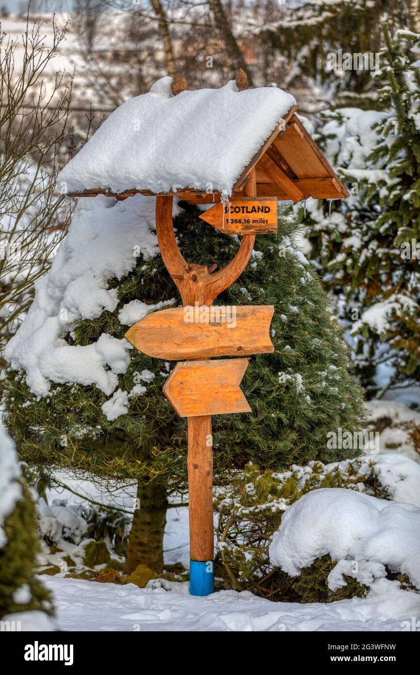 Beautiful signpost in winter garden Stock Photo - Alamy