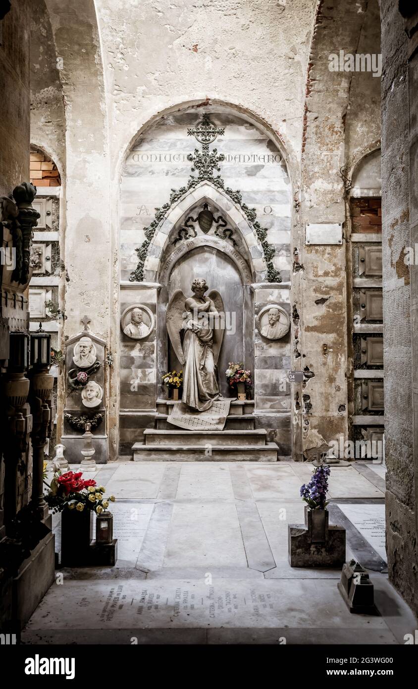 Statue of angel on an old tomb located in Genoa cemetery - Italy Stock ...
