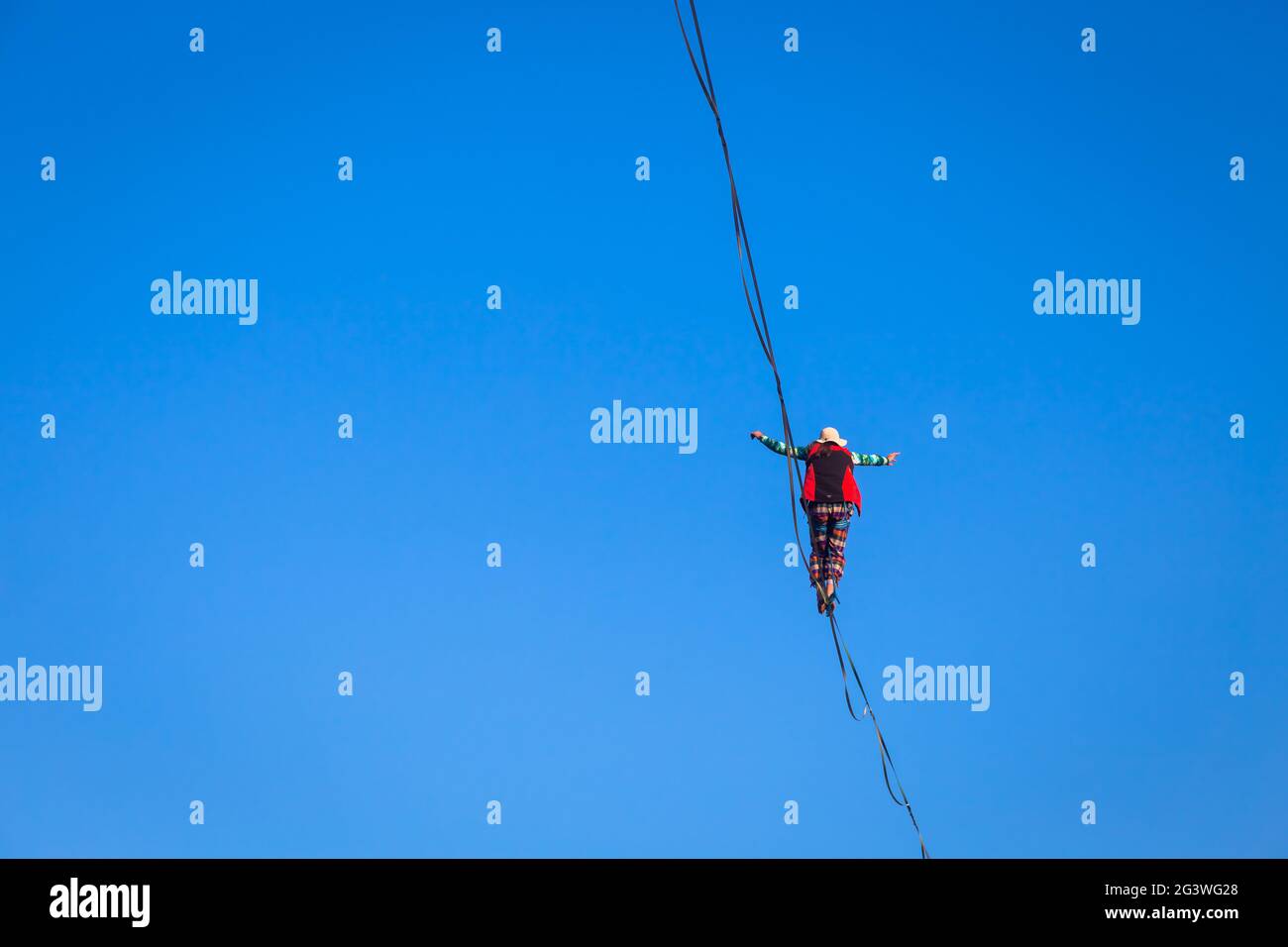 Slackline athlete during his performance. Concentration, balance and ...
