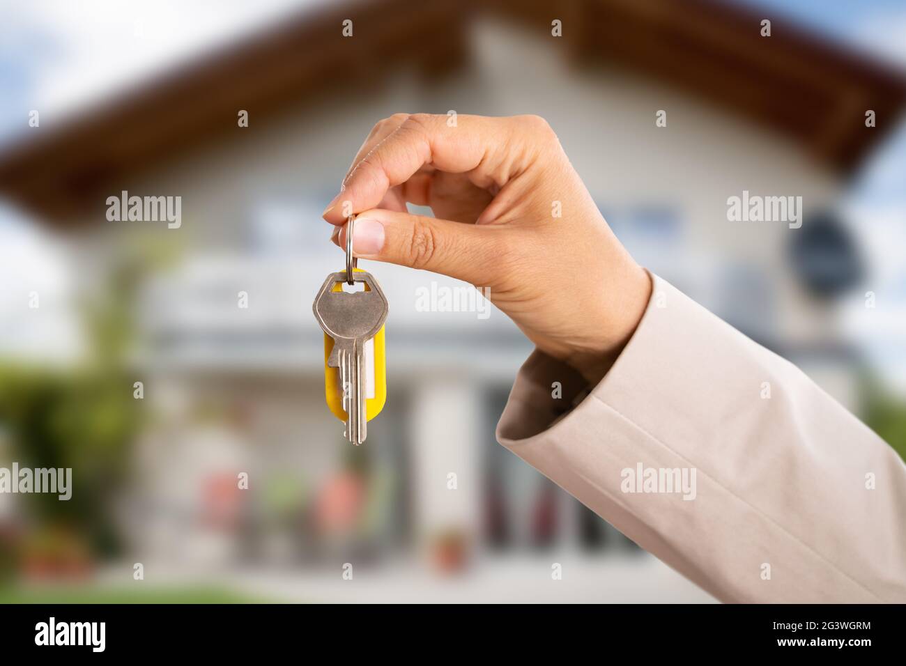 Estate agent keys woman holding hi-res stock photography and images - Alamy