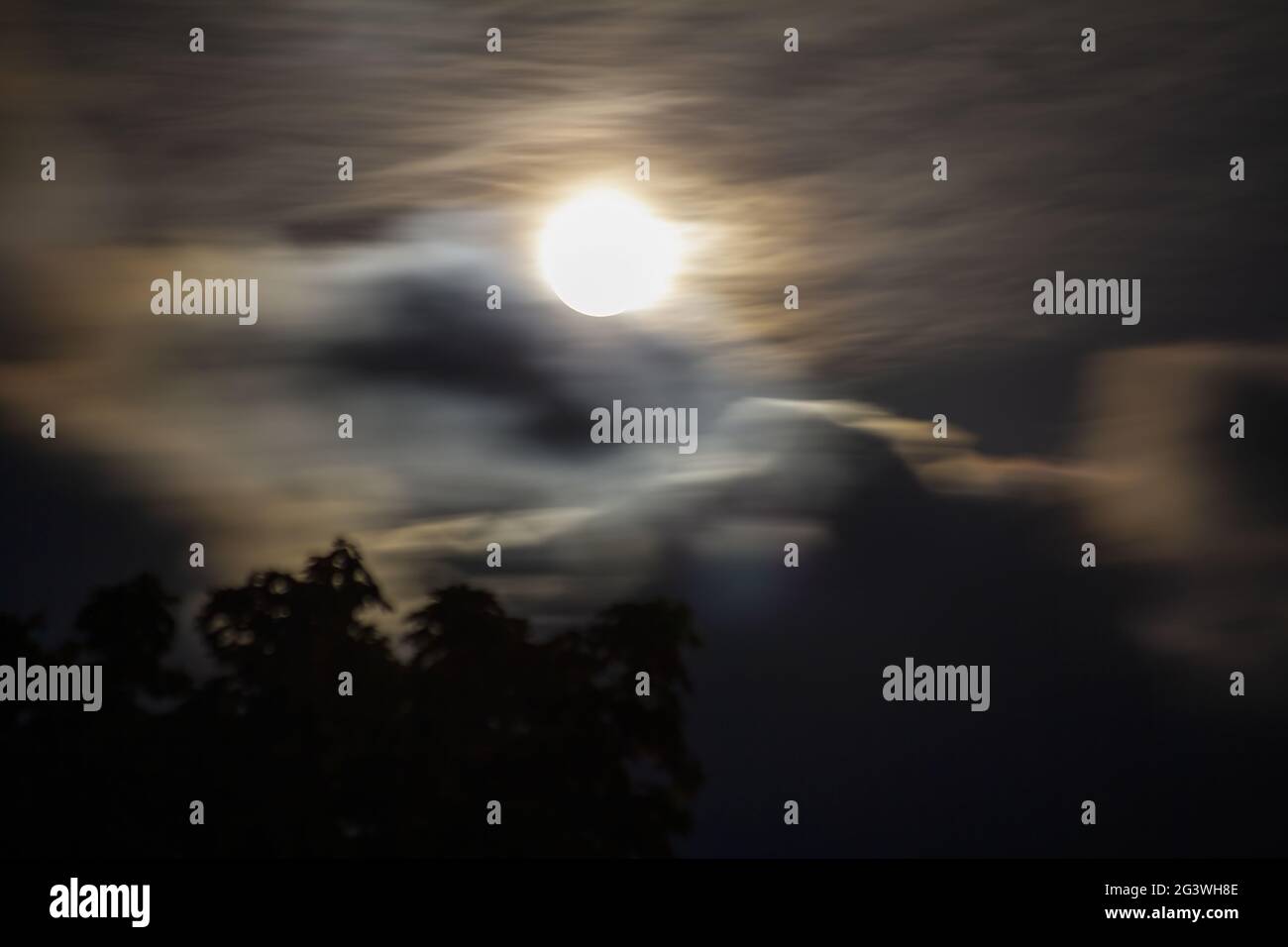 Full moon behind clouds night hi-res stock photography and images - Alamy