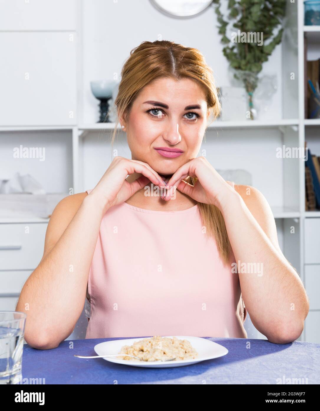 Disgusted woman eating hi-res stock photography and images - Alamy