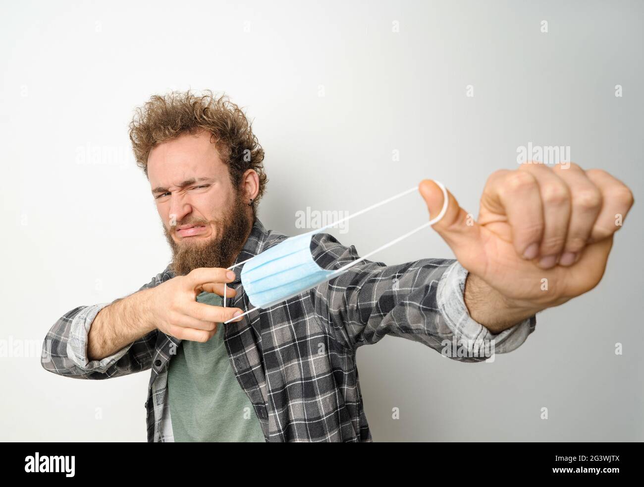 Man holding mask face hi-res stock photography and images - Alamy