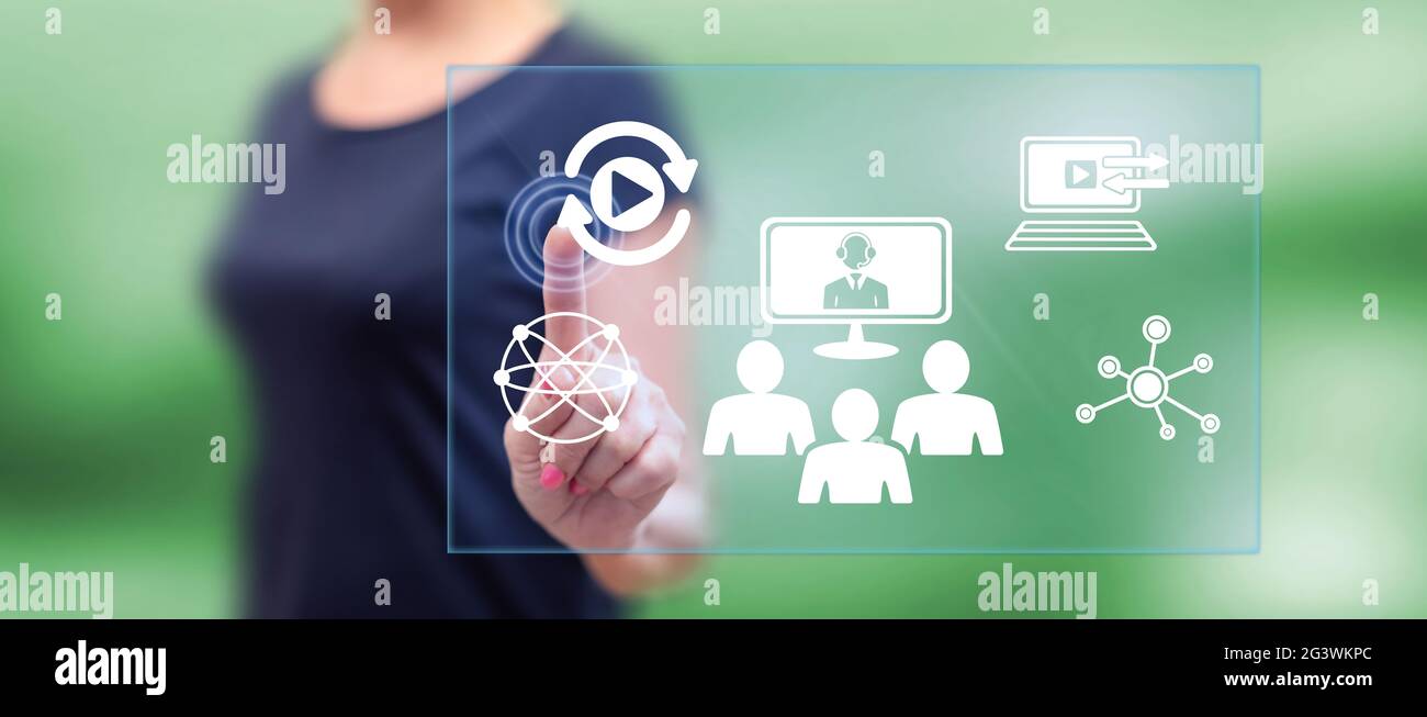 Woman touching a video conference concept on a touch screen with her ...