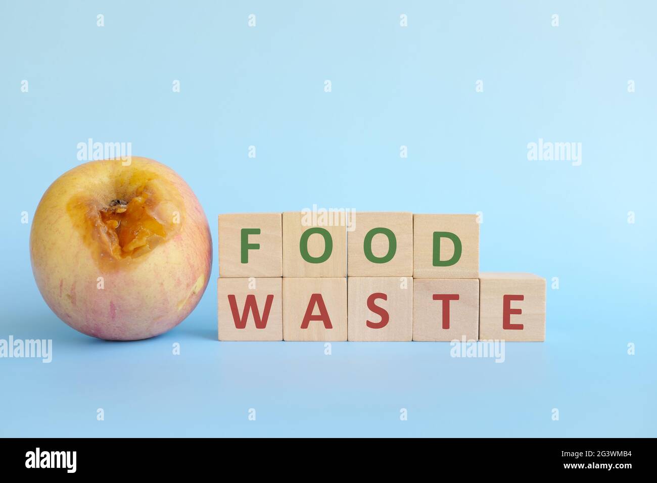Food waste concept. Fruit and vegetable scrap with wooden blocks ...
