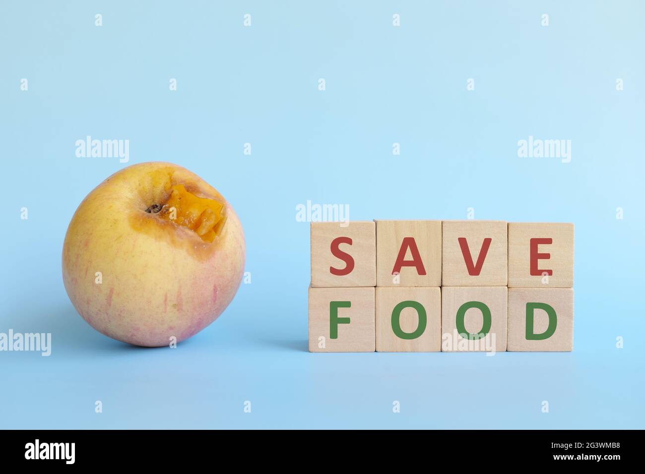 Save food concept. Apple scrap with wooden blocks typography in blue ...
