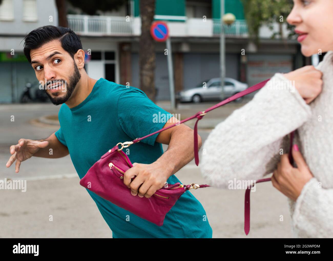 Man is stole the handbag from stranger woman Stock Photo - Alamy